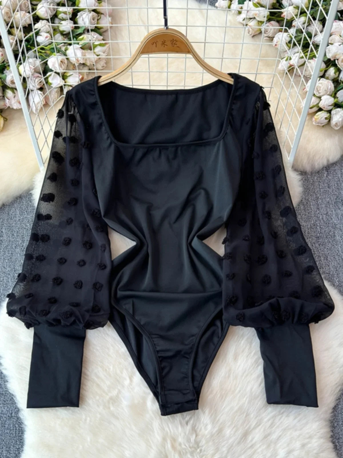 black mesh pattern bodysuit